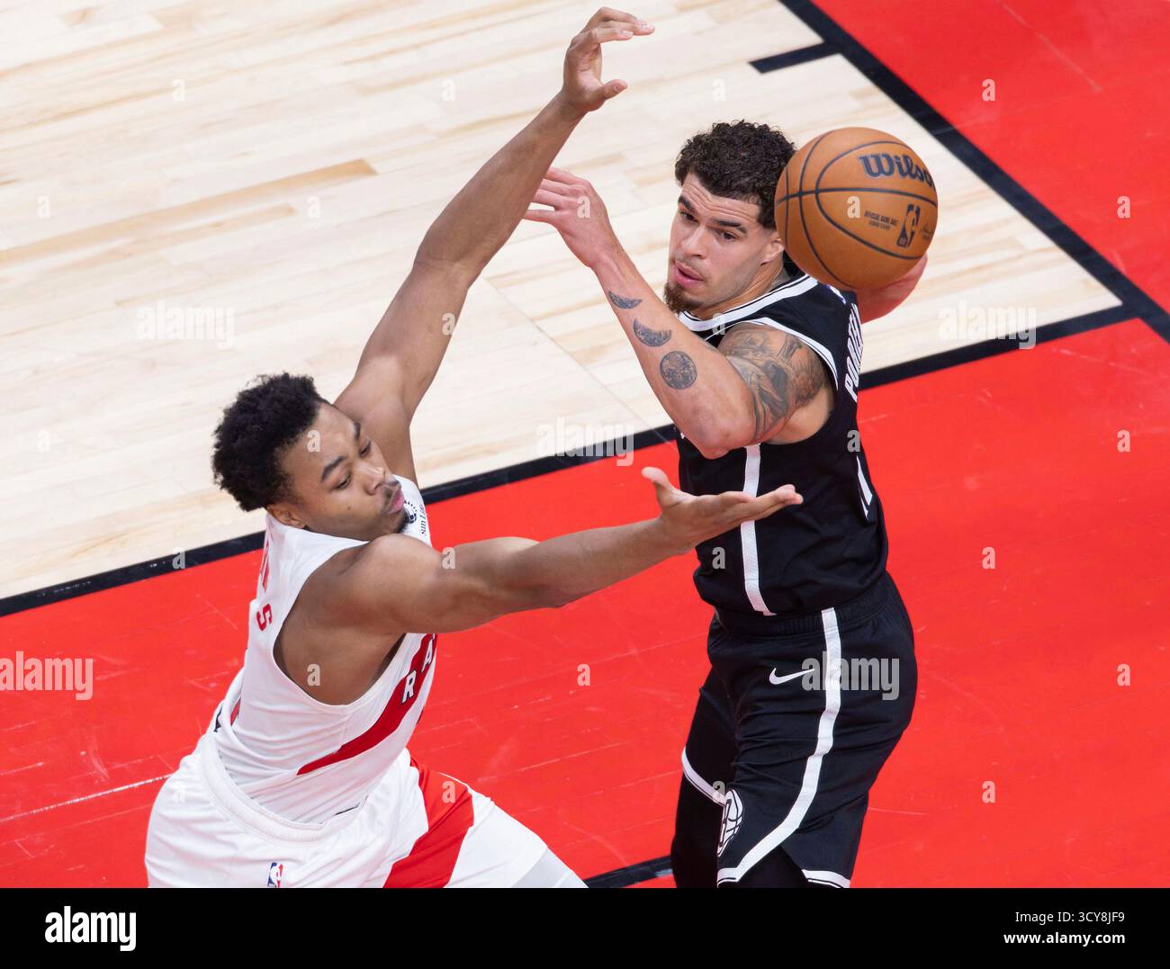 Toronto, Canada. 17th Oct, 2025. Scottie Barnes (L) of Toronto Raptors ...