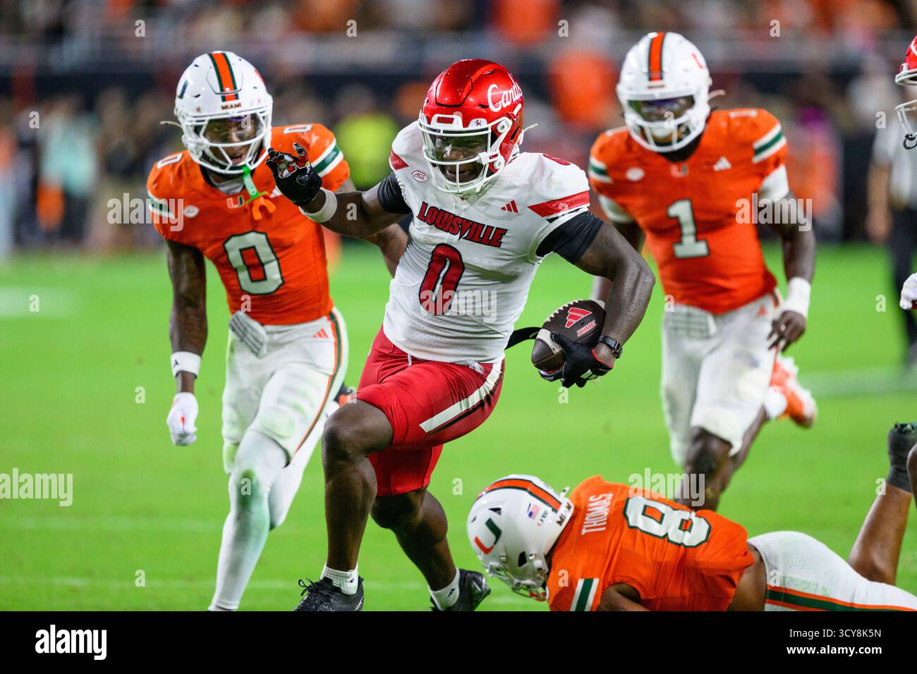 Louisville wide receiver Chris Bell (0) runs with the ball to score a ...