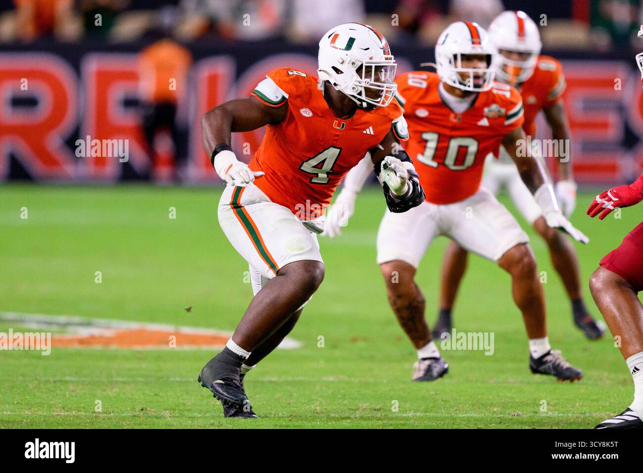Miami defensive lineman Rueben Bain Jr. (4) runs a play during an NCAA ...
