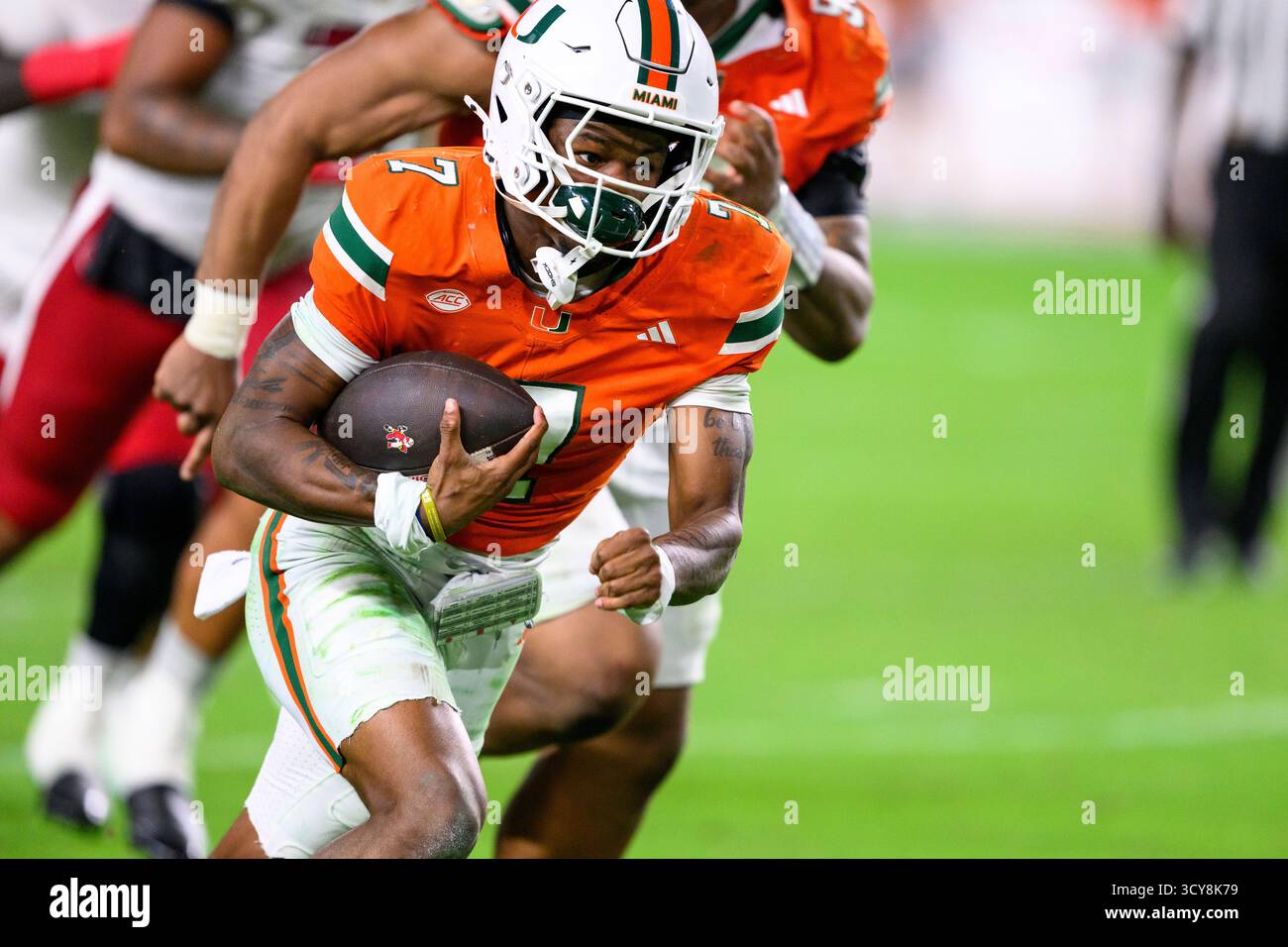 Miami defensive back Zechariah Poyser (7) runs with ball after ...
