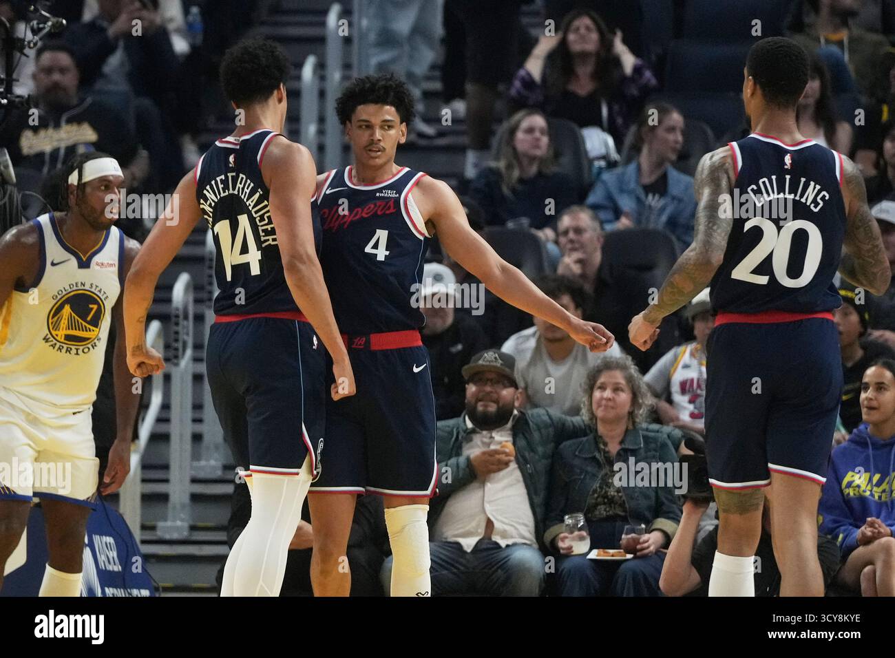Los Angeles Clippers guard Kobe Sanders (4) is congratulated by center ...