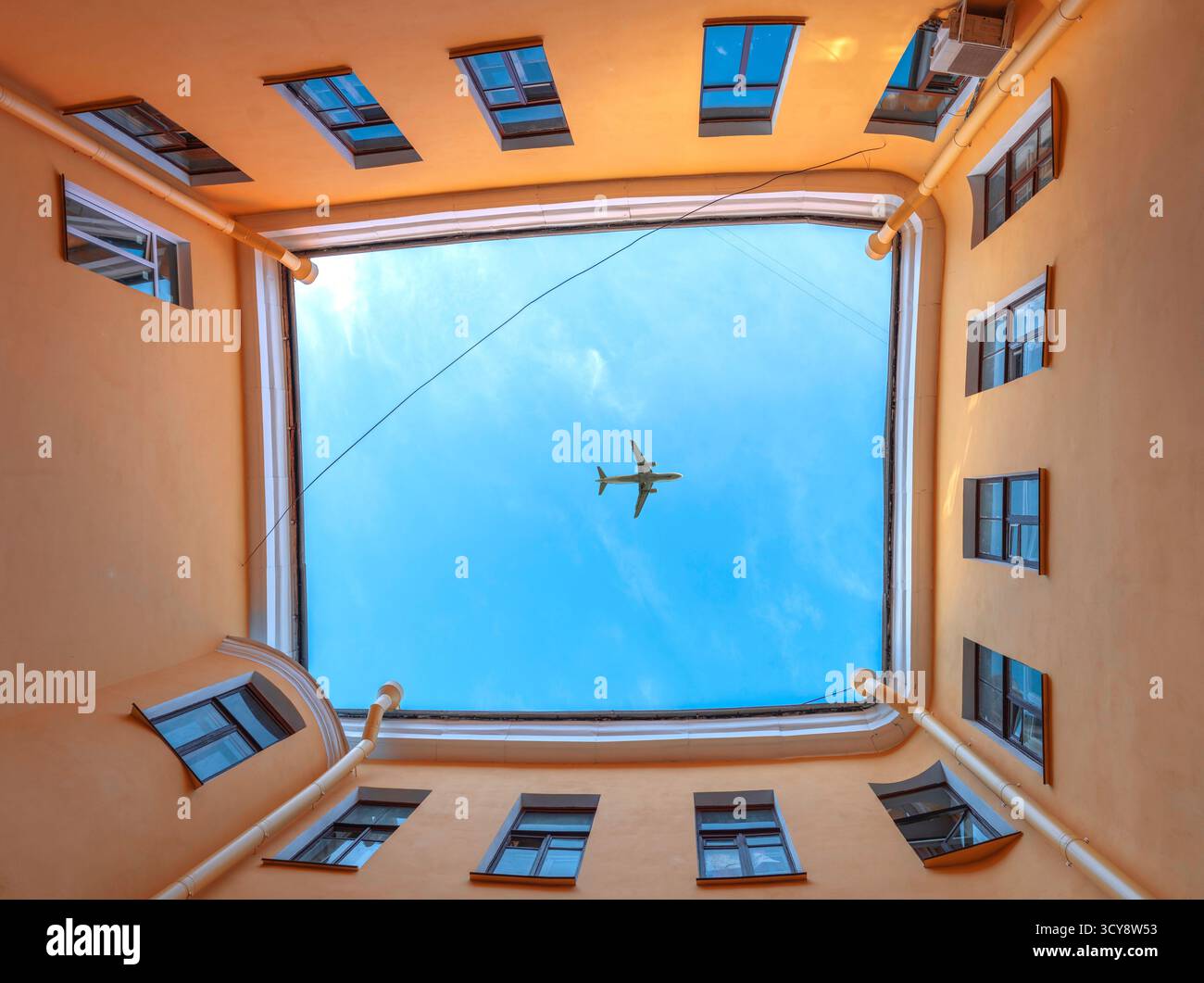 Transport plane flies over city hi-res stock photography and images - Alamy