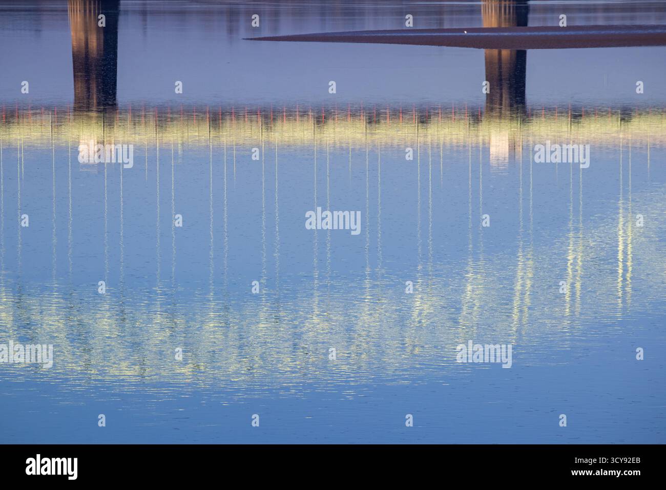 Reflection of the Silver Jubilee Bridge in calm blue water of River ...