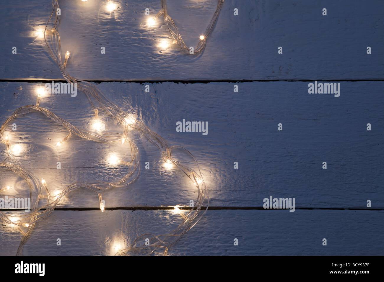 Garland on empty wooden hi-res stock photography and images - Alamy