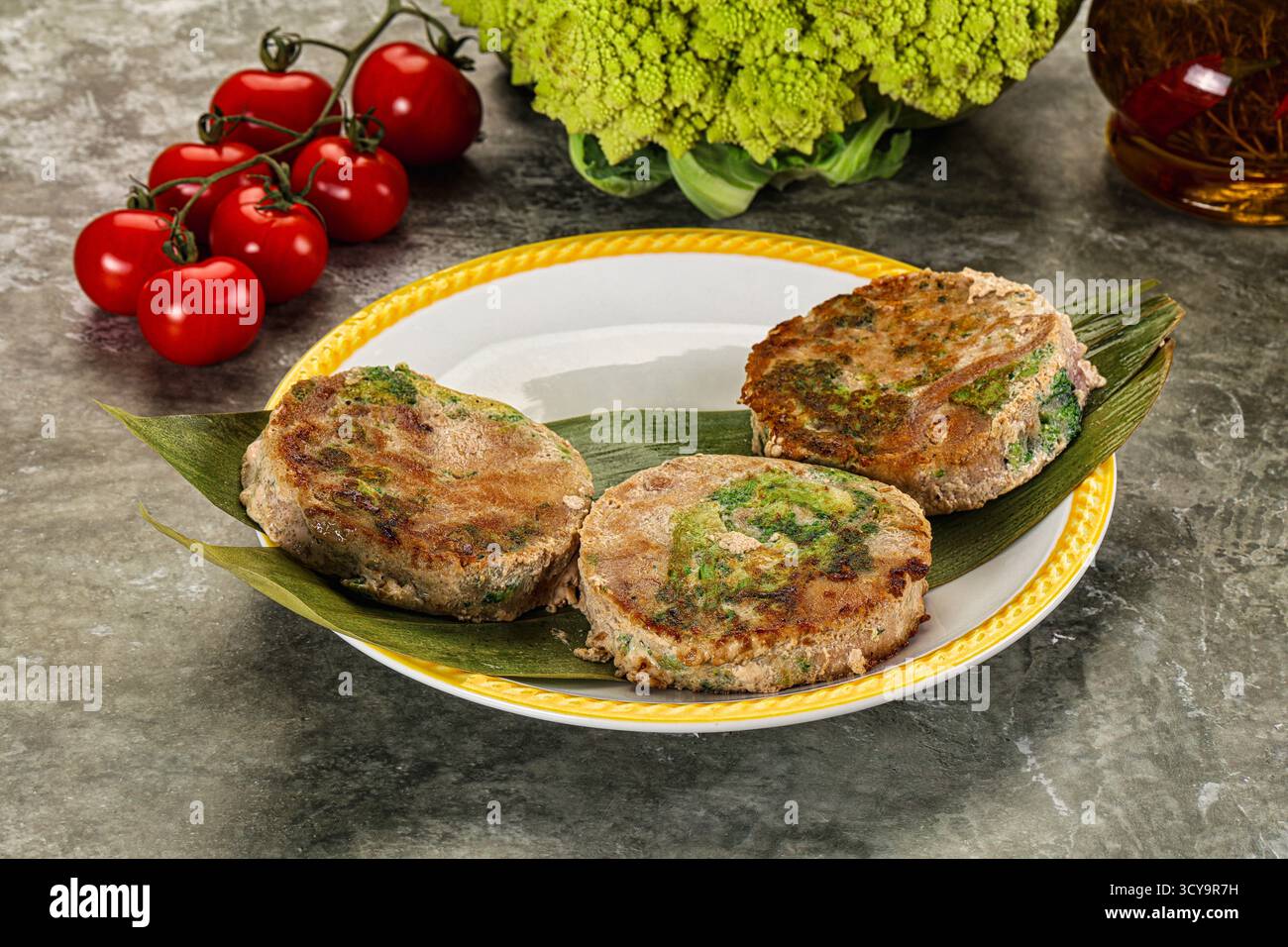 Roasted tuna medallion with broccoli cabbage Stock Photo - Alamy