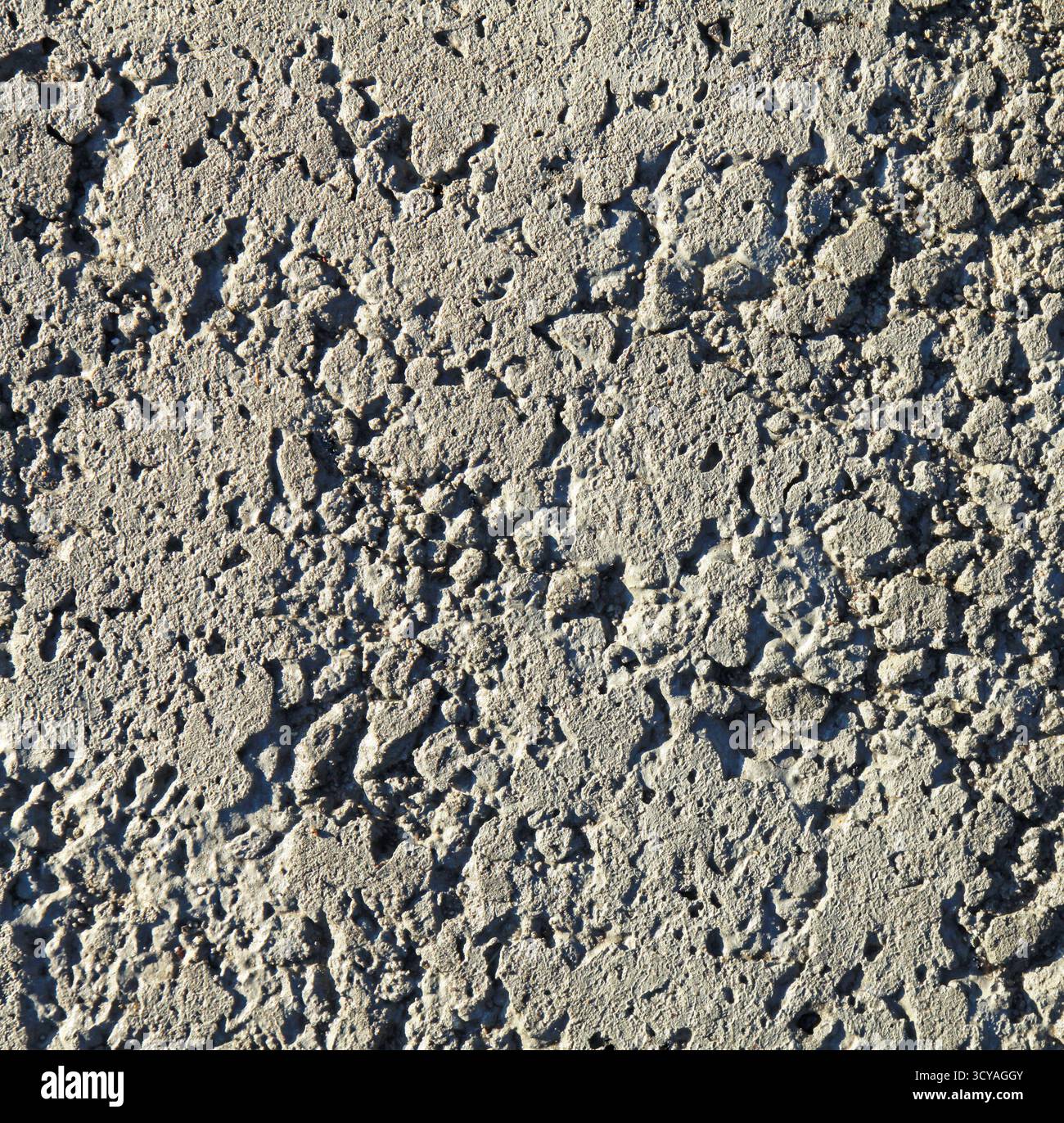 Light-grey concrete wall, background. Rough cement covering of gray ...