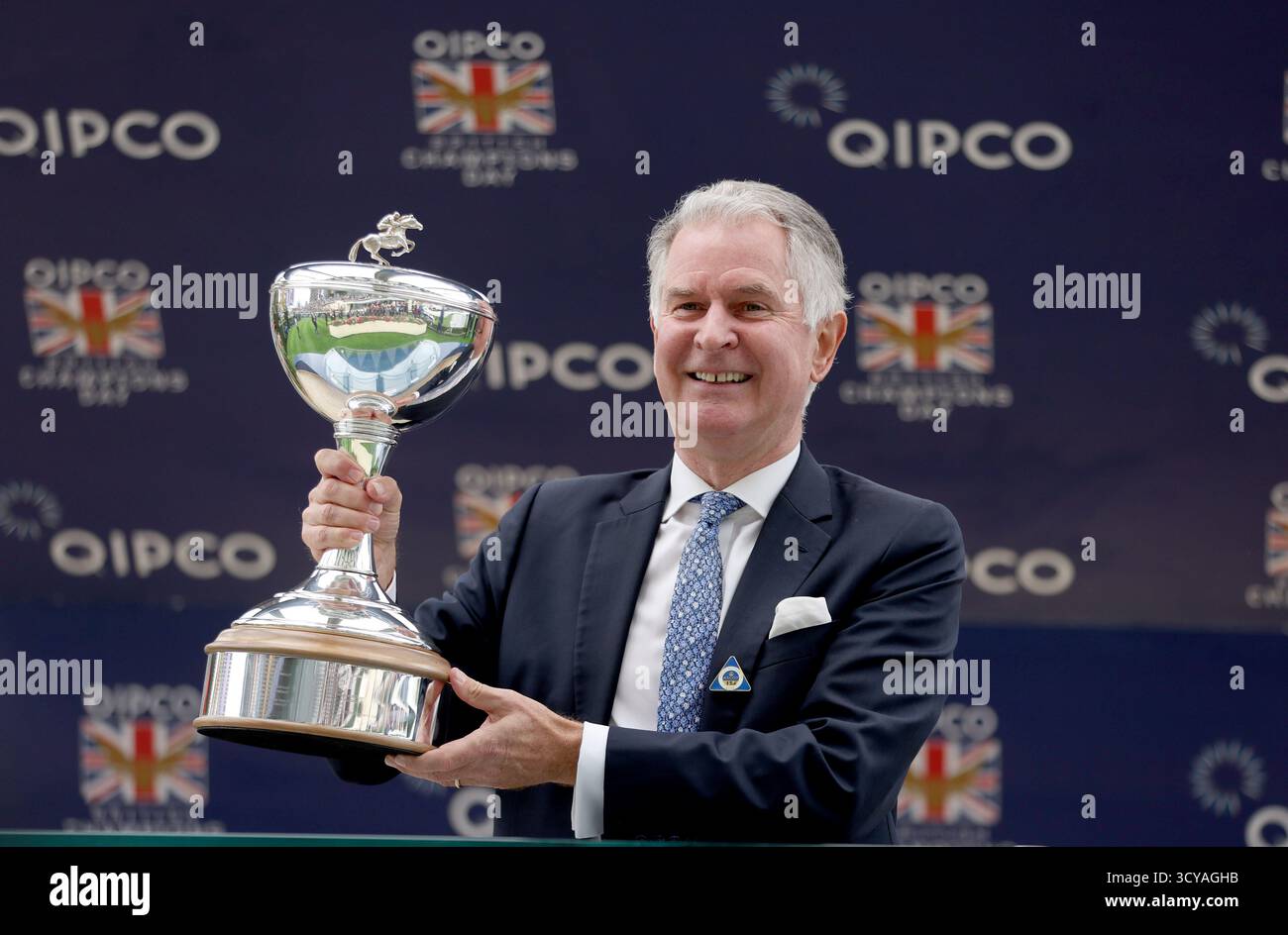 Chief Operating Officer at Godolphin Hugh Anderson is presented with ...