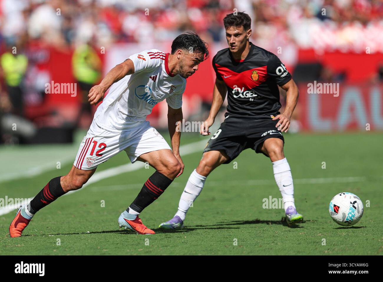 Sevilla, Spain. 18th Oct, 2025. Gabriel Suazo of Sevilla FC and Javi ...