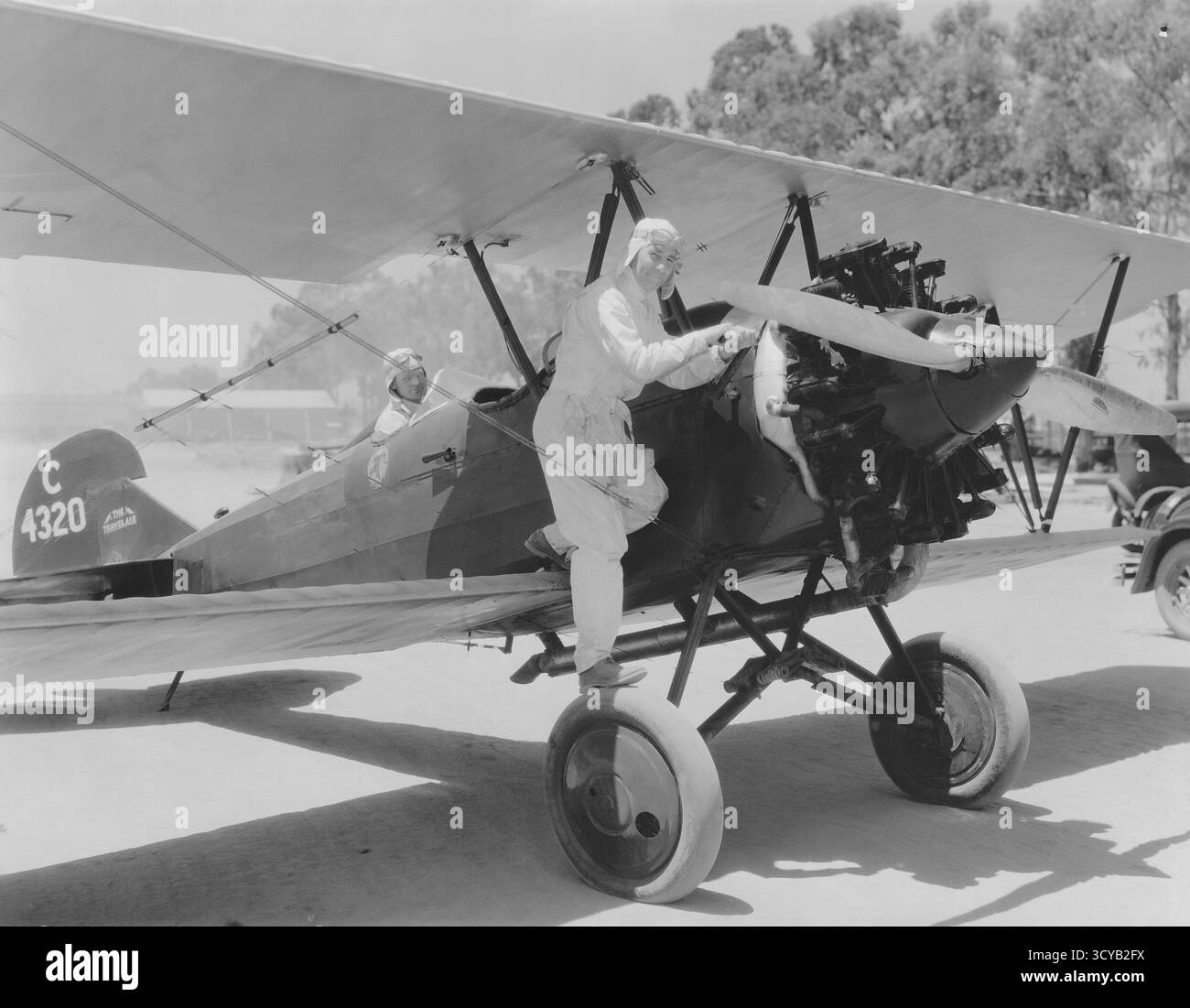 Male pilot standing airplane in Black and White Stock Photos & Images ...