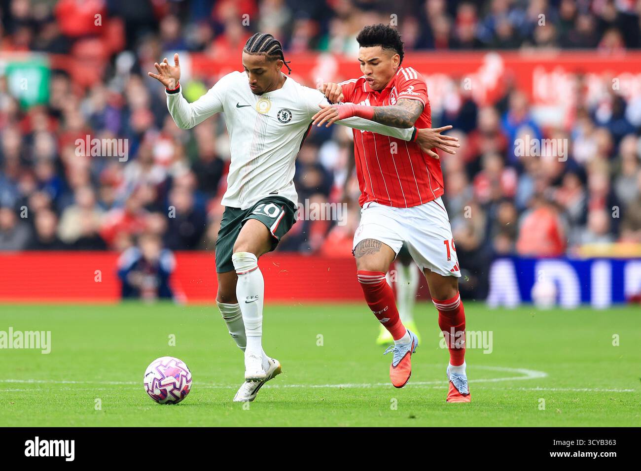 Nottingham, UK. 18th Oct, 2025. Joao Pedro of Chelsea is challenged by ...