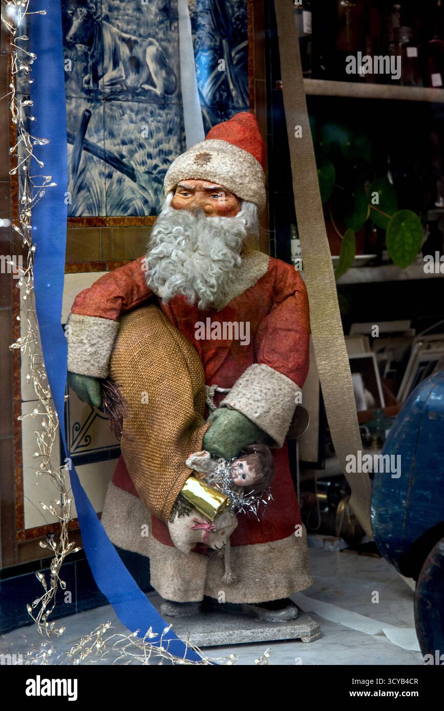 Vintage Santa Claus with a sack of toys in the window of Unicorn ...