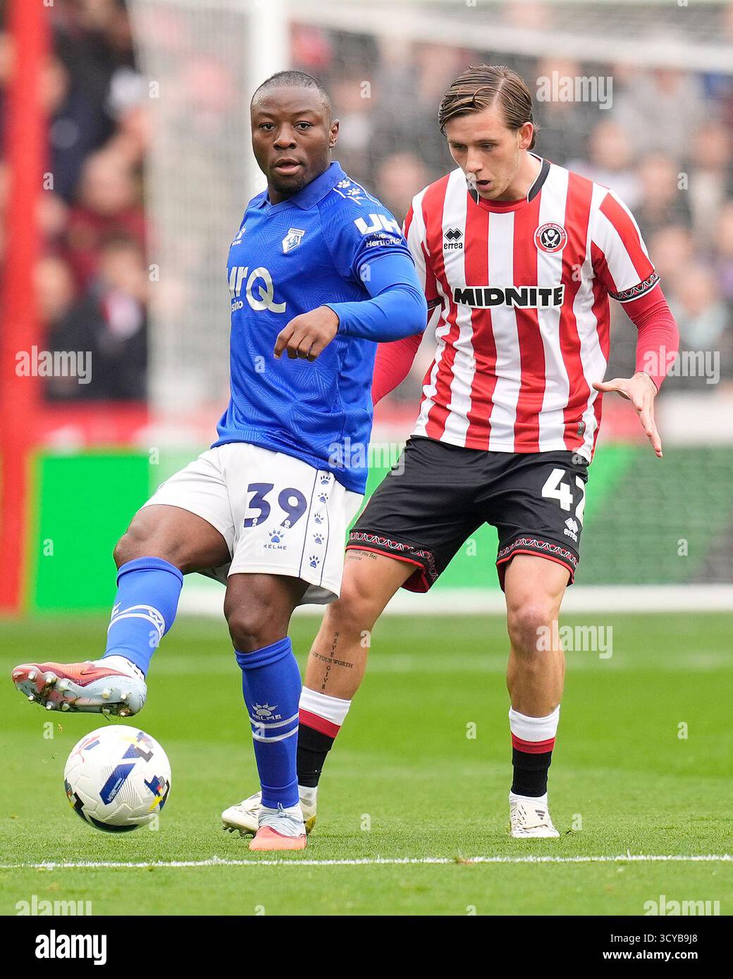 Watford's Edo Kayembe (left) and Sheffield United's Sydie Peck battle ...