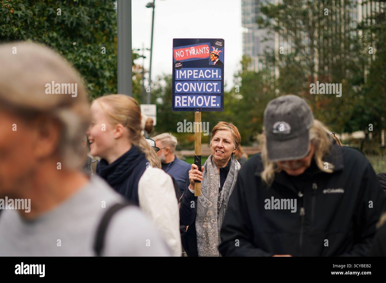 A demonstrator holds a placard during a protest outside the U.S ...