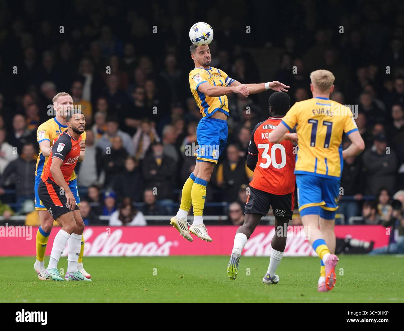 Mansfield Town's Stephen McLaughlin (centre) in action during the Sky ...