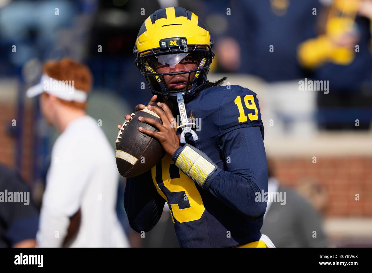 Michigan quarterback Bryce Underwood warms up before an NCAA college football game against ...
