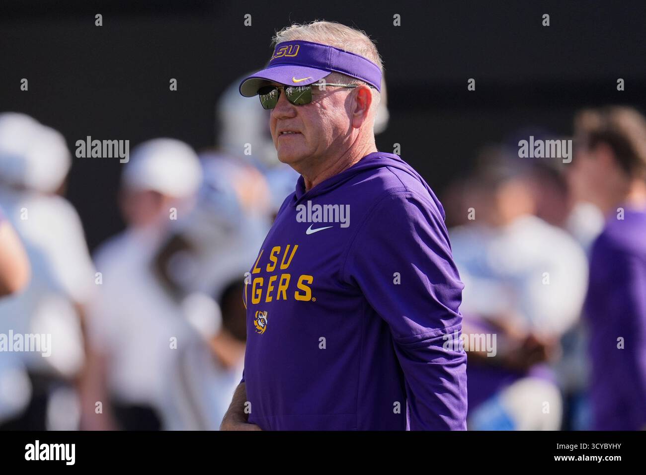 LSU head coach Brian Kelly walks the field before an NCAA college ...