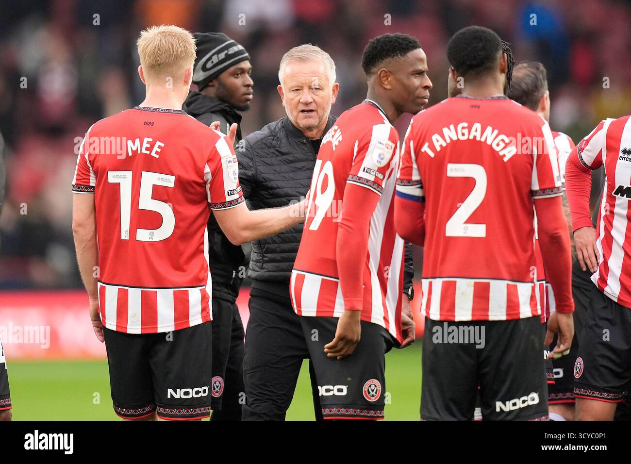 Sheffield United manager Chris Wilder (centre) with Ben Mee after the ...
