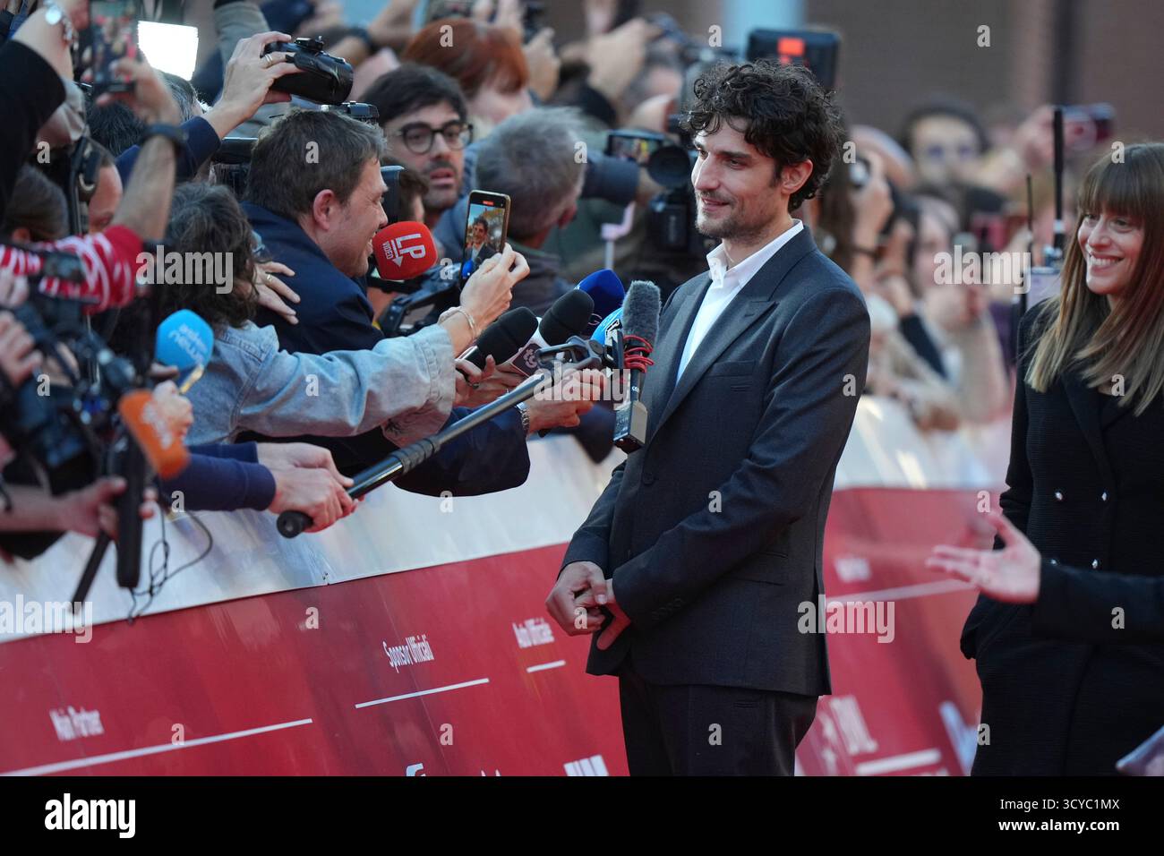 Actor Louis Garrel answers to reporters on the red carpet for the ...