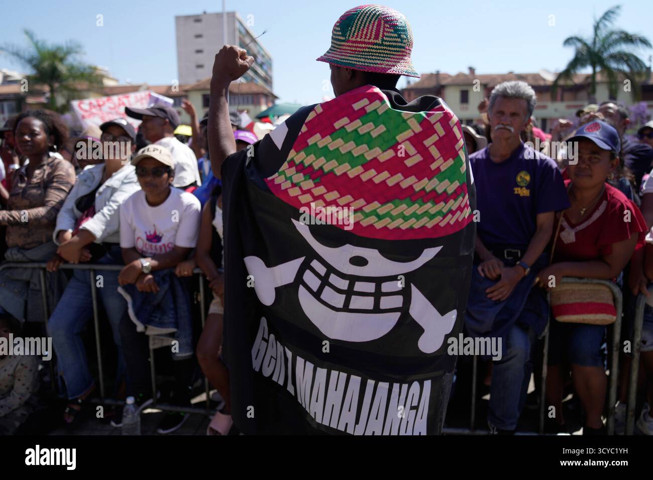 A Gen Z Madagascar supporter wears a skull and crossbones flag during a ...
