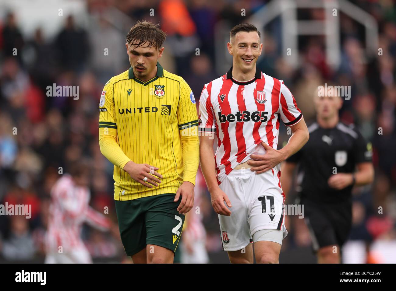 Wrexham's Callum Doyle (left) and Stoke City's Robert Bozenik during ...