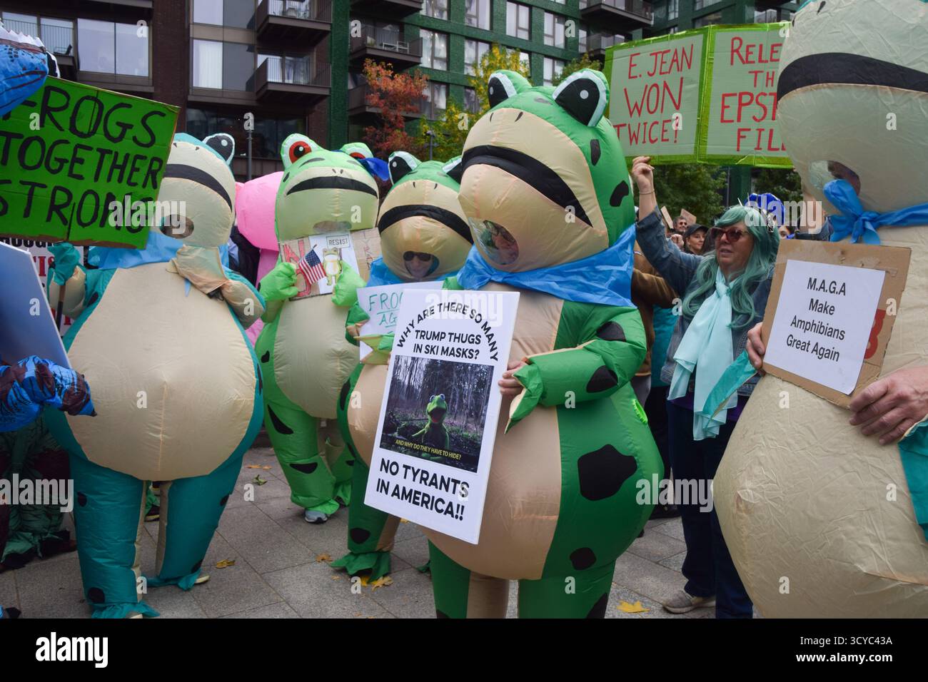 London, UK. 18th October 2025. Protesters wearing inflatable frog ...