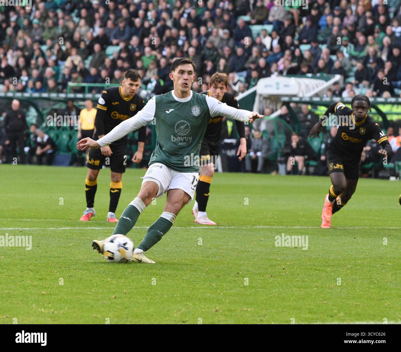 Jamie mcgrath of hibs scores 2nd goal from penalty spot hi-res stock ...