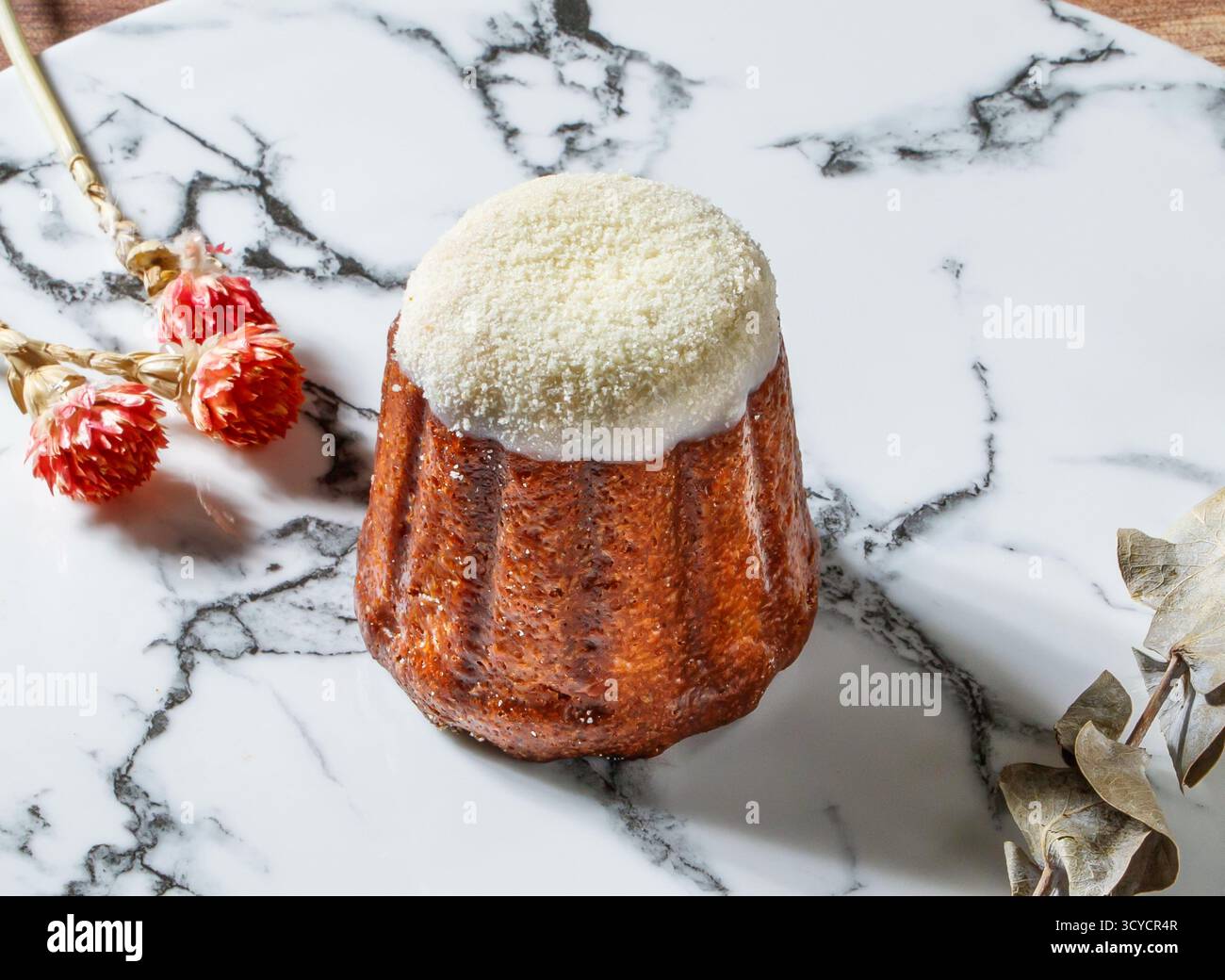 Canele de Bordeaux, a traditional French pastry topped with with ...