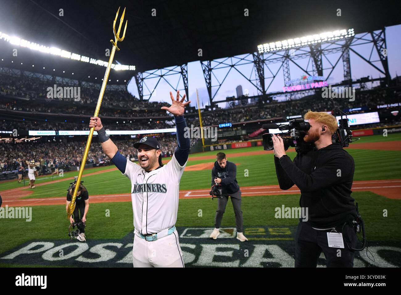 Seattle Mariners third baseman Eugenio Suarez holds the trident to ...