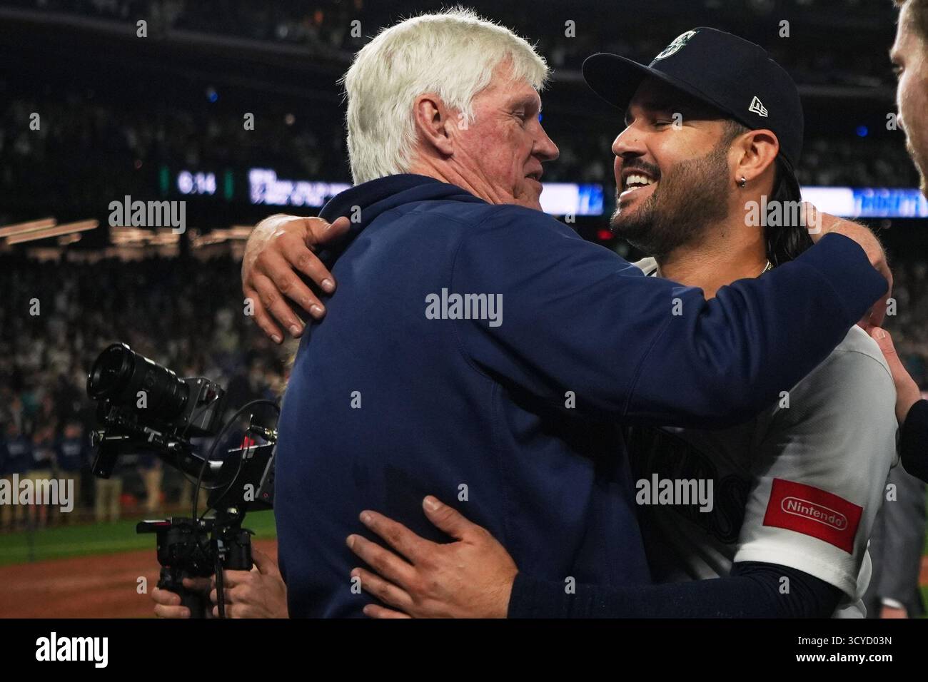 Seattle Mariners third baseman Eugenio Suarez, right, hugs Mariners ...