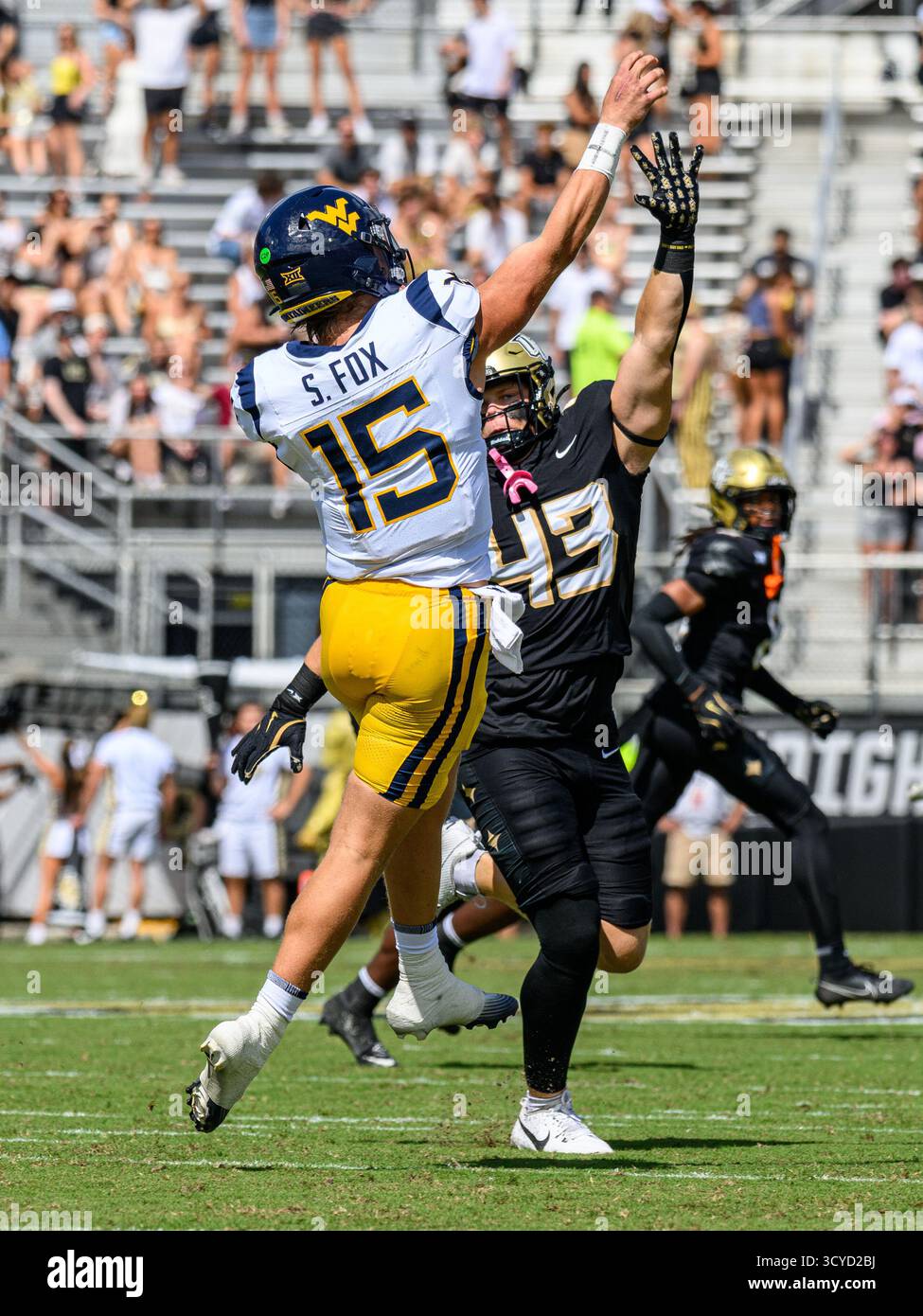 October 18, 2025: West Virginia Mountaineers quarterback Scotty Fox Jr. (15) gets pressured bUCF ...