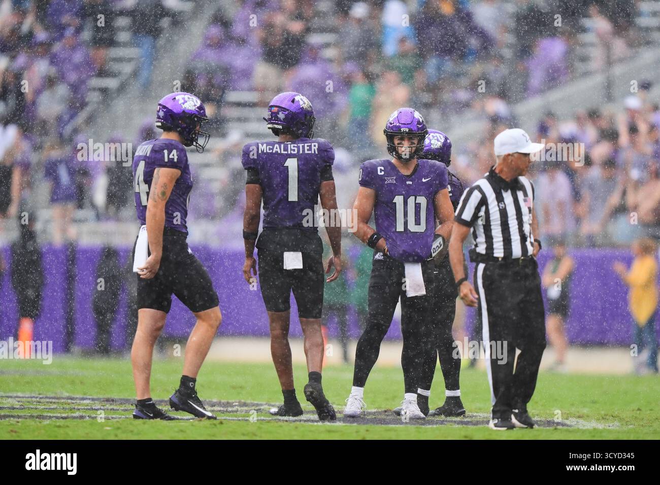 TCU quarterback Josh Hoover (10) stands in the rain with wide receivers ...