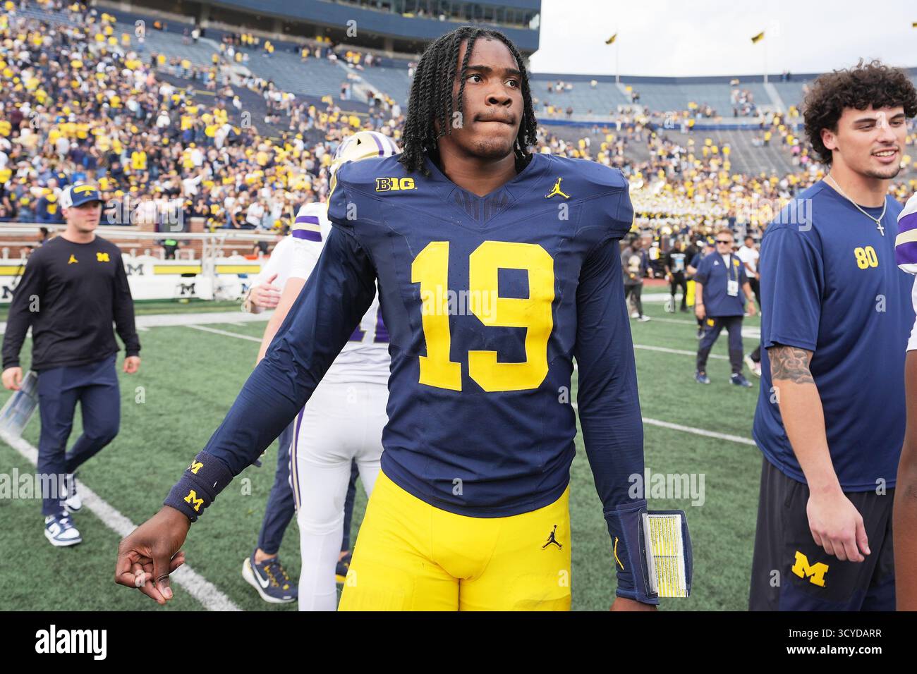 Michigan quarterback Bryce Underwood walks off the field after the team's win against Washington ...