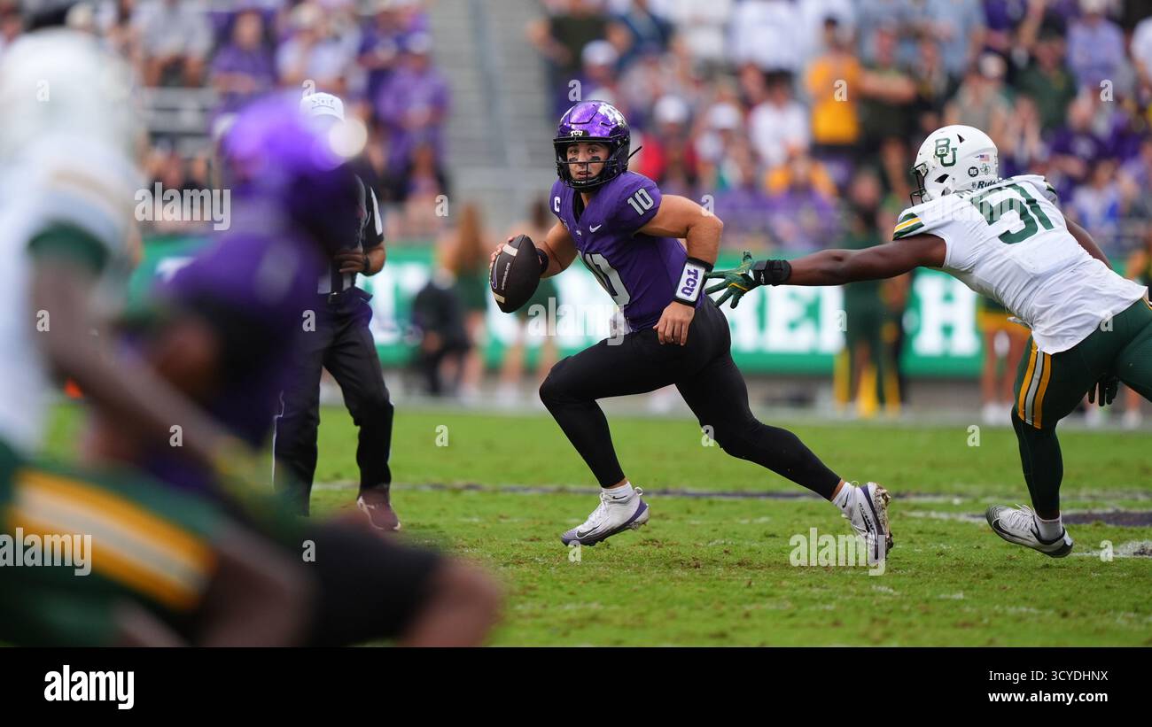 TCU quarterback Josh Hoover evades Baylor linebacker Kamauryn Morgan ...