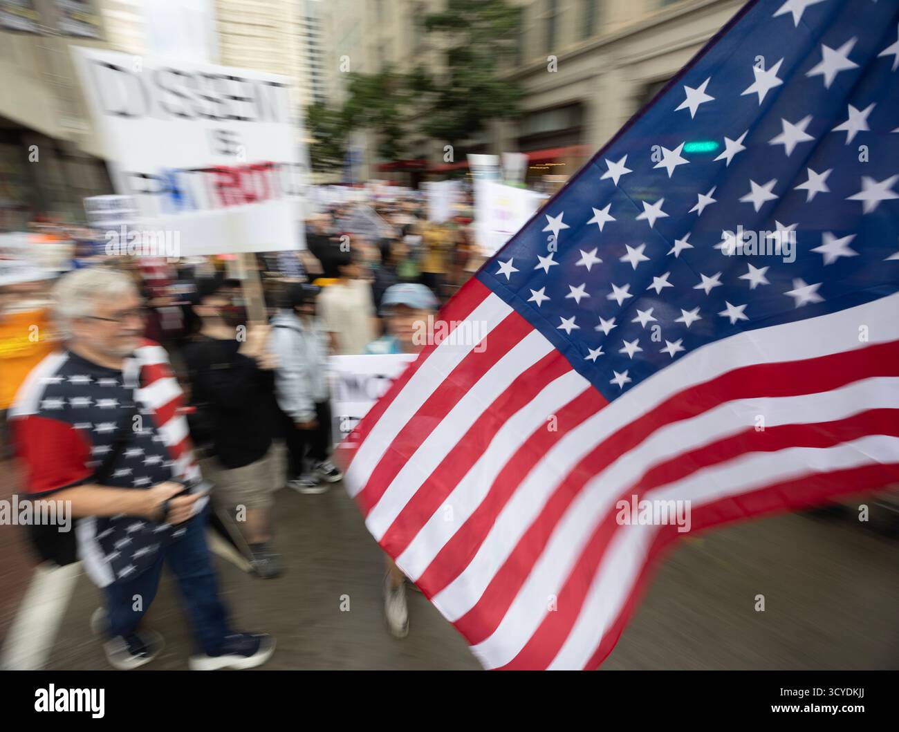 Dallas, USA 18 Oct. 2025 A crowd marches at Pacific Plaza. (Shoun A ...