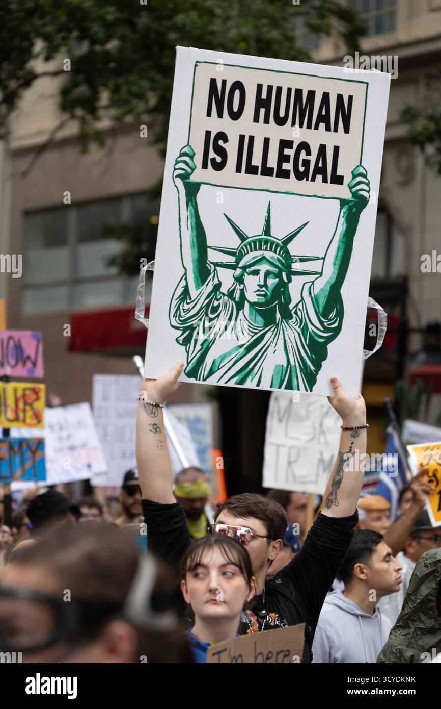 Dallas, USA 18 Oct. 2025 A crowd marches at Pacific Plaza. (Shoun A ...