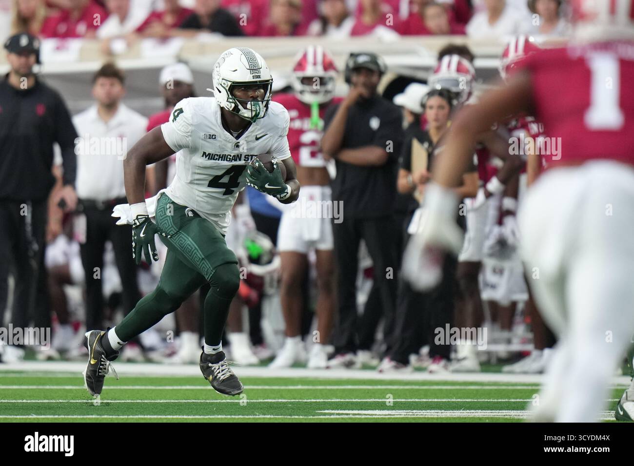 Michigan State running back Elijah Tau-Tolliver (4) runs during the ...