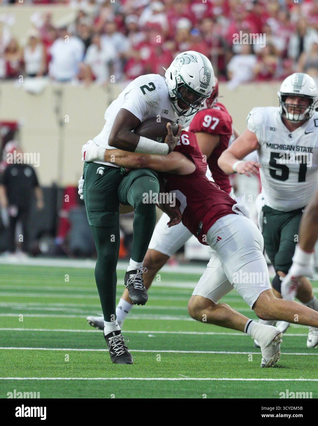 Michigan State quarterback Aidan Chiles (2) his tackled by Indiana ...