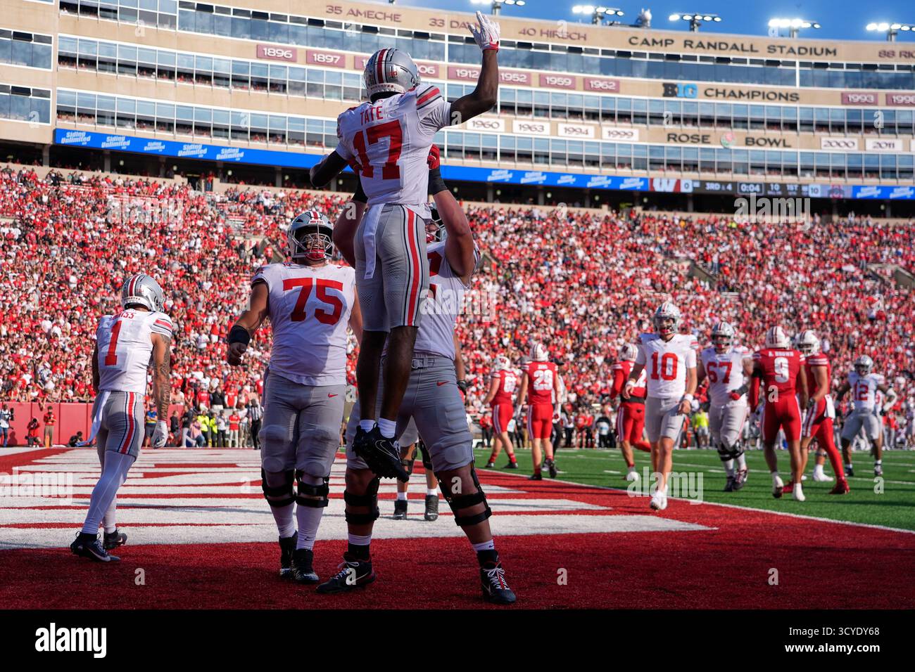 Ohio State's Joshua Padilla lifts Carnell Tate after a topuchdown catch ...