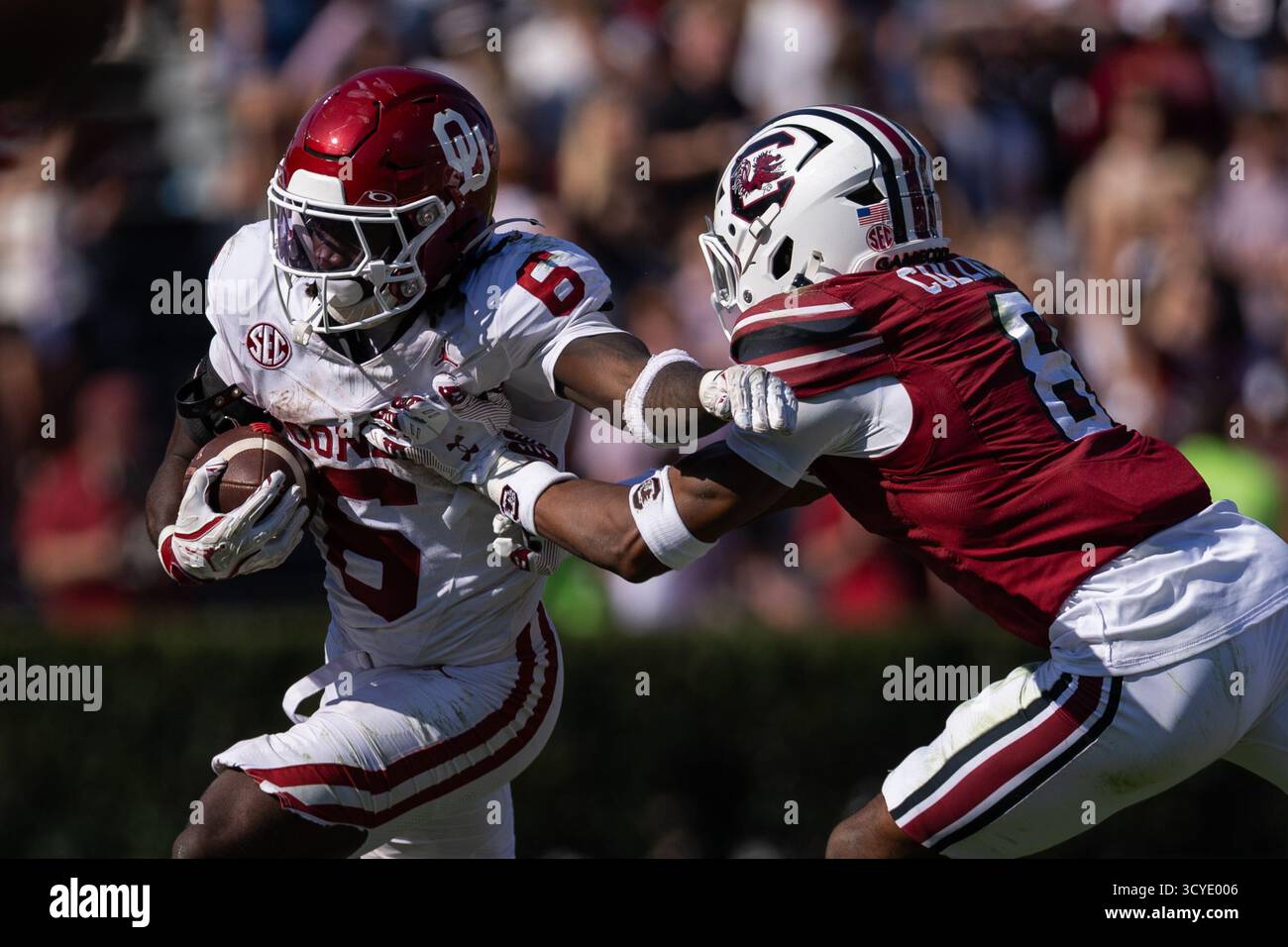 Oklahoma running back Tory Blaylock (6) is forced out by South Carolina ...