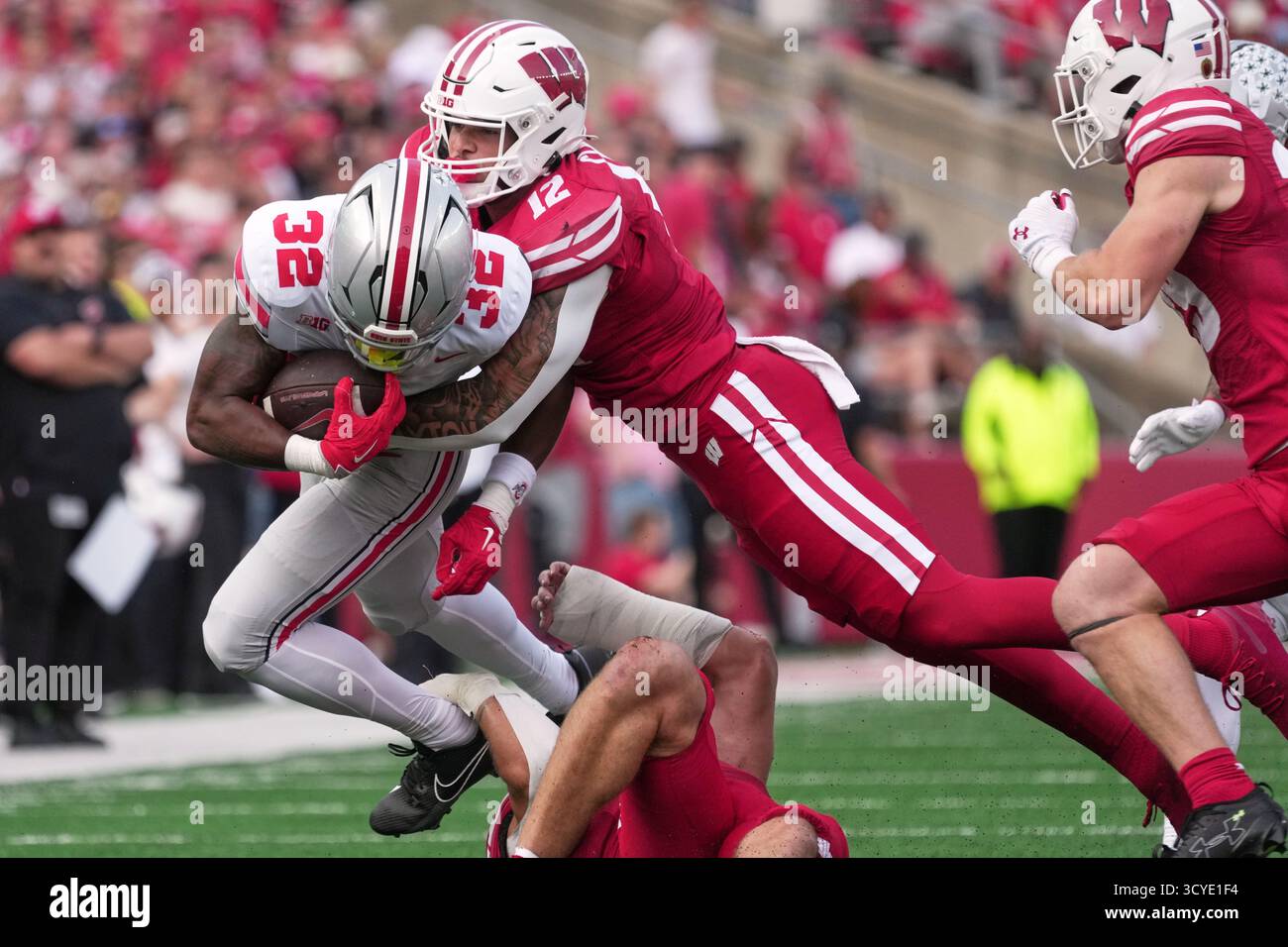 Ohio State's Isaiah West tries to get past Wisconsin's Nick Clayton ...