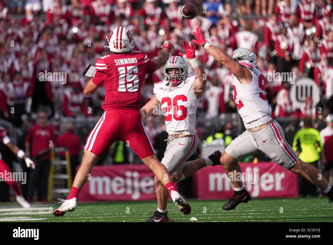 Wisconsin's Hunter Simmons throws the ball in front of Ohio State's ...