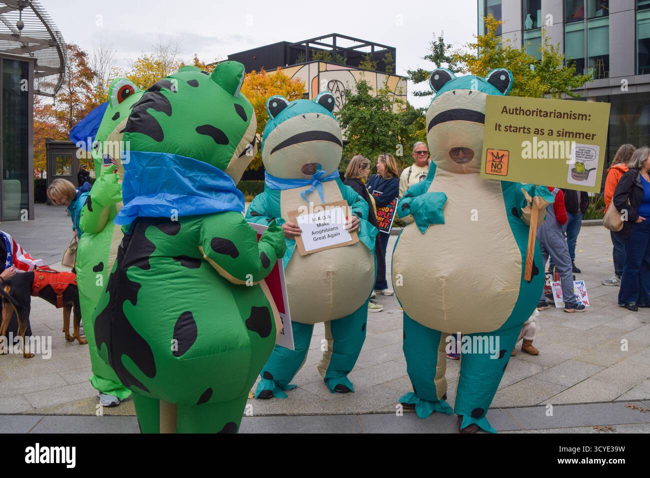 London, UK. 18th October 2025. Protesters wearing inflatable frog ...
