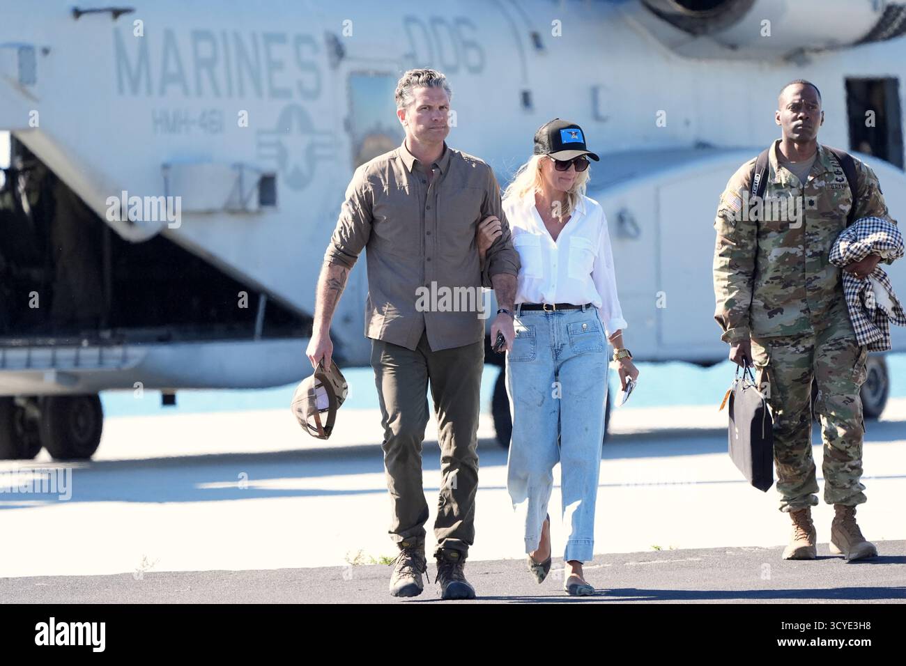 Defense Secretary Pete Hegseth, from left, and his wife Jennifer ...