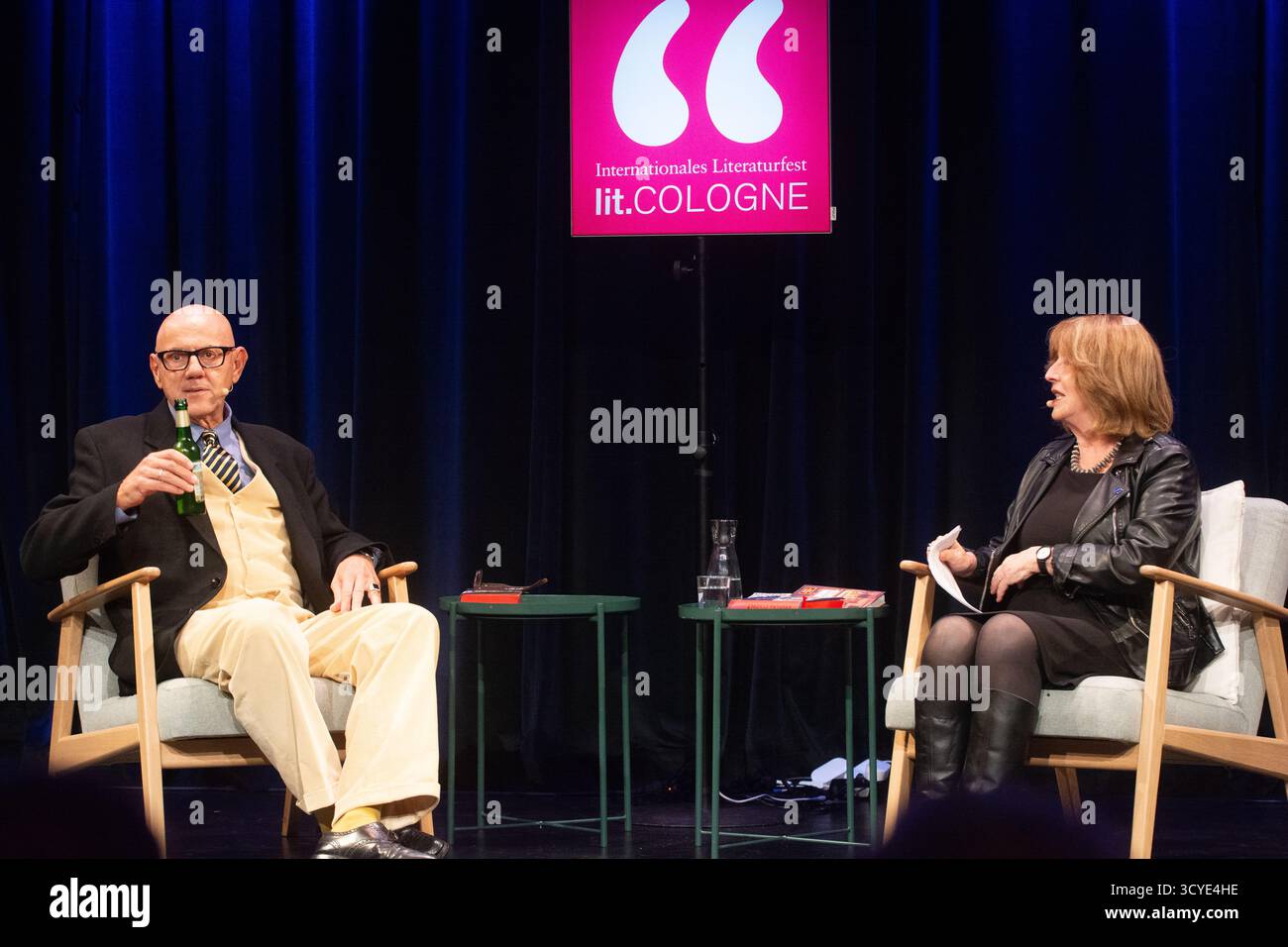 Andreas Pfluger, a German writer, and Angela Spizig are on the stage of ...