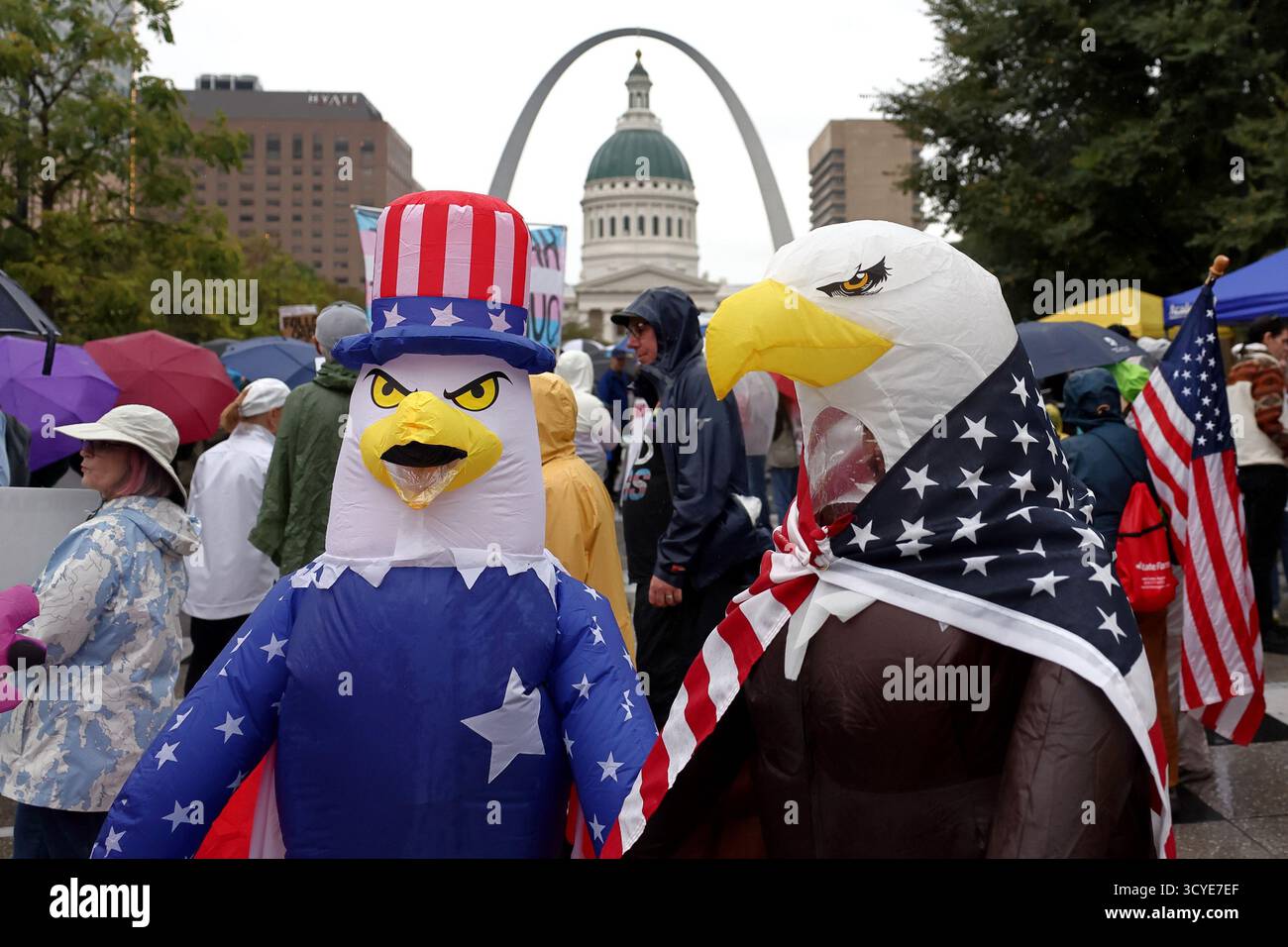 Demonstrators wearing inflatable bald eagle costumes gather in Kiener ...