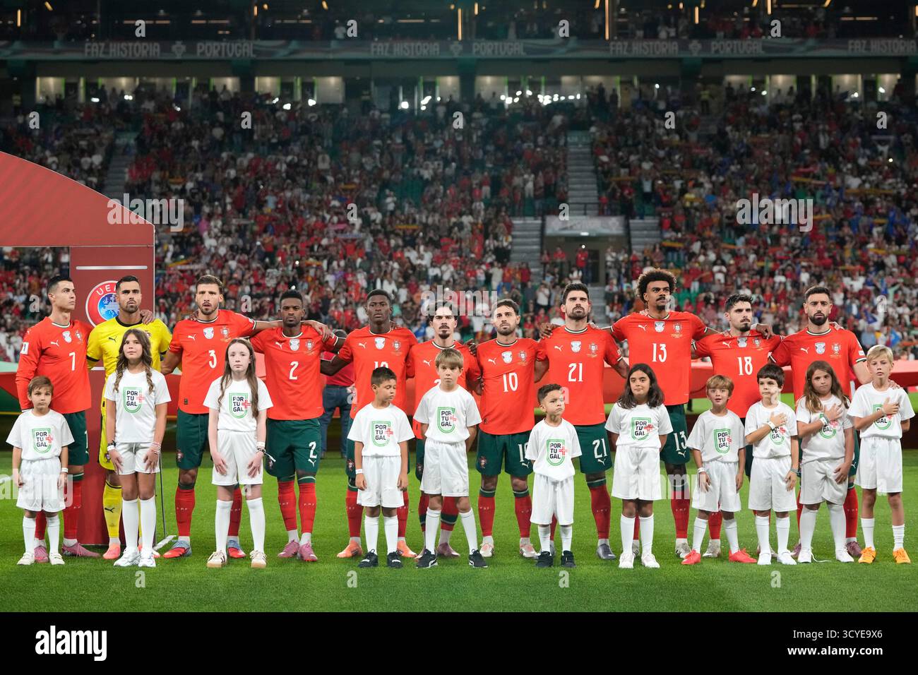 Portugal players stand on the pitch during the national anthems before ...