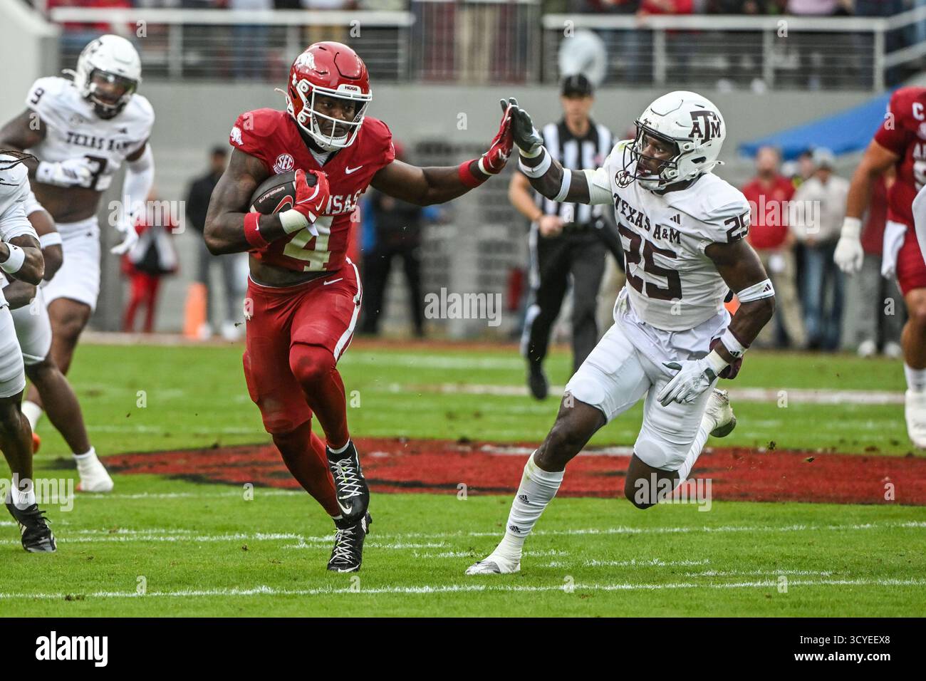 Arkansas running back Mike Washington Jr. (4) tries to get past Texas A ...