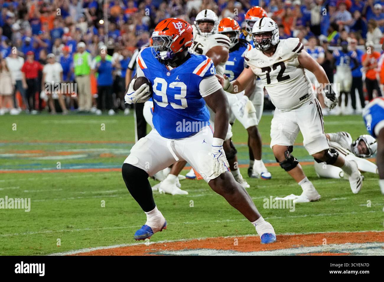 Florida defensive tackle Michai Boireau (93) runs after intercepting a ...