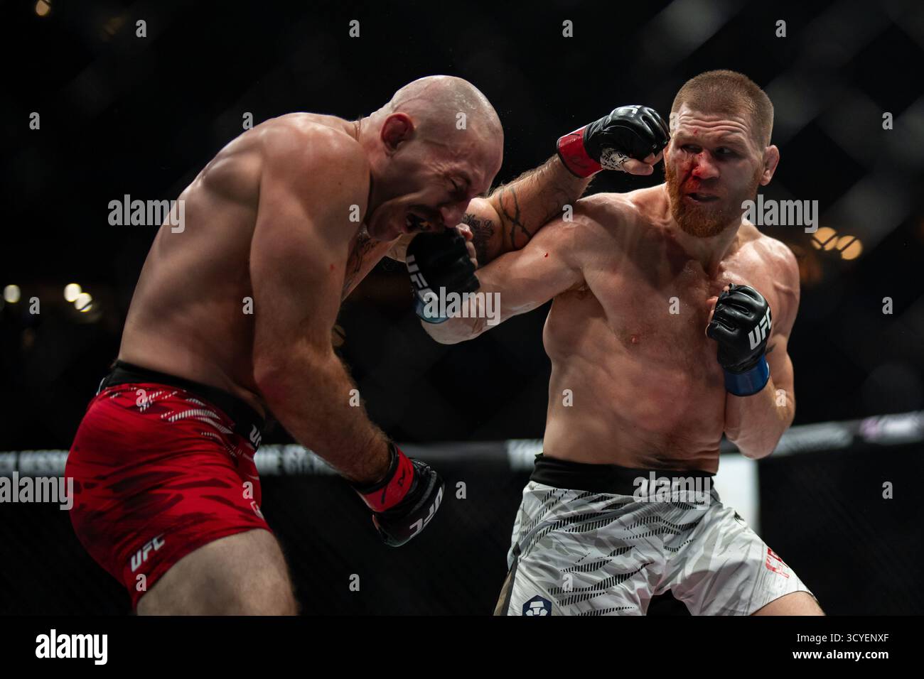 Kyle Nelson, left, of Canada, and Matt Frevola, right, fight during a ...