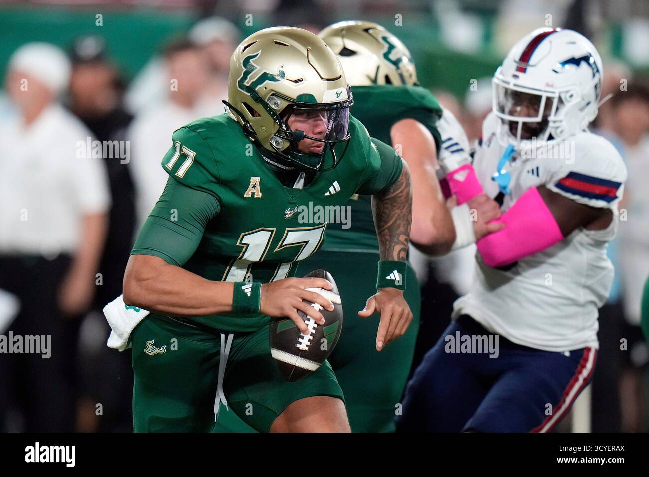 South Florida Bulls quarterback Byrum Brown (17) scrambles for yardage ...